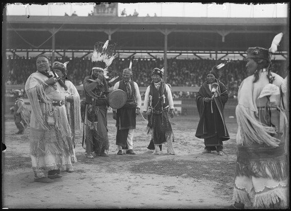 Indians in full regalia posing for a photograph at the rodeo grounds ...