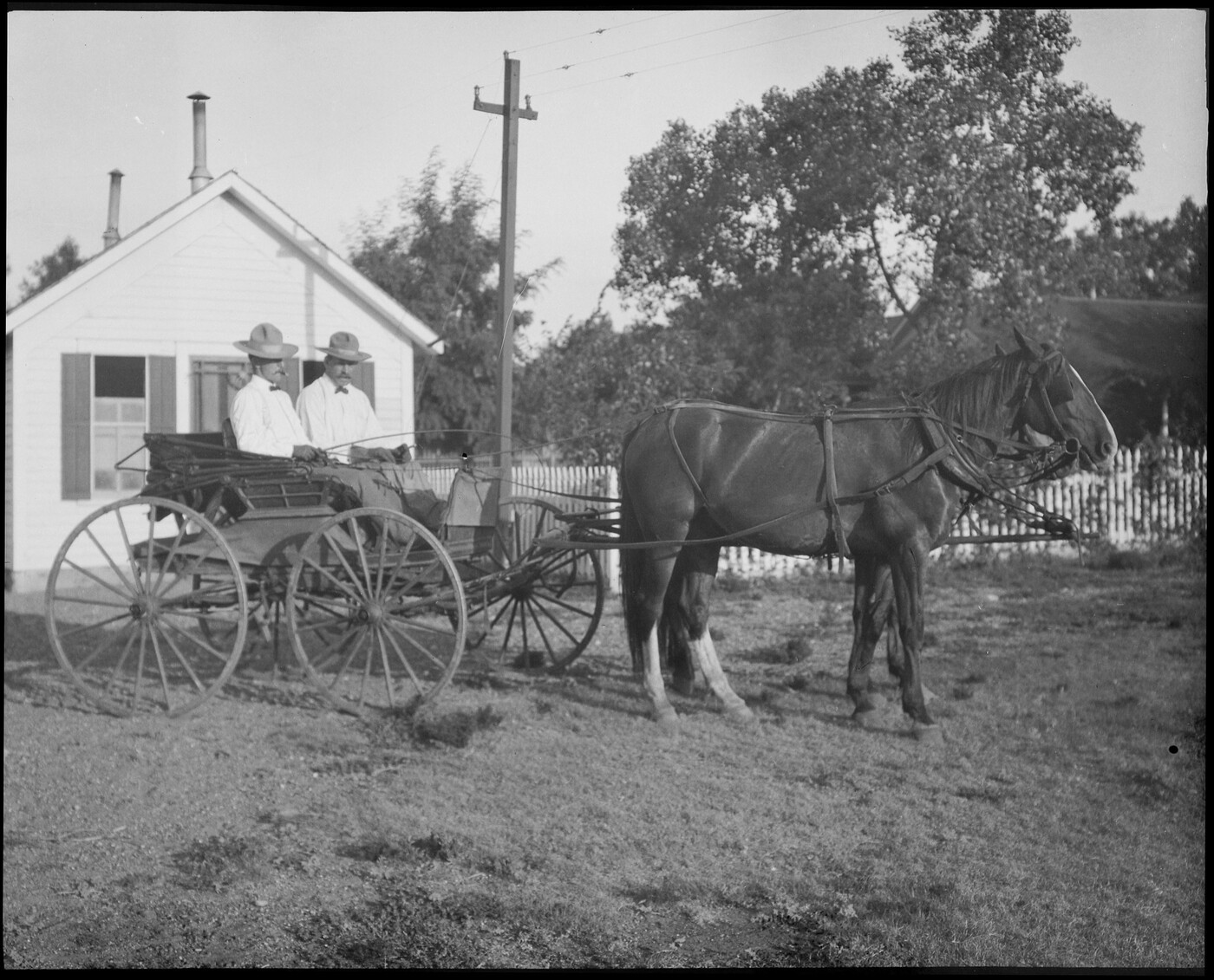 Two men sitting in a typical ranch rig at JA Ranch headquarters | Amon ...
