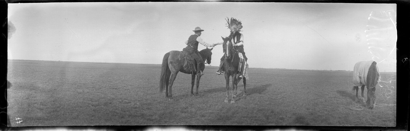 An Indian (Erwin E. Smith) shaking hands with one of the Matador ...