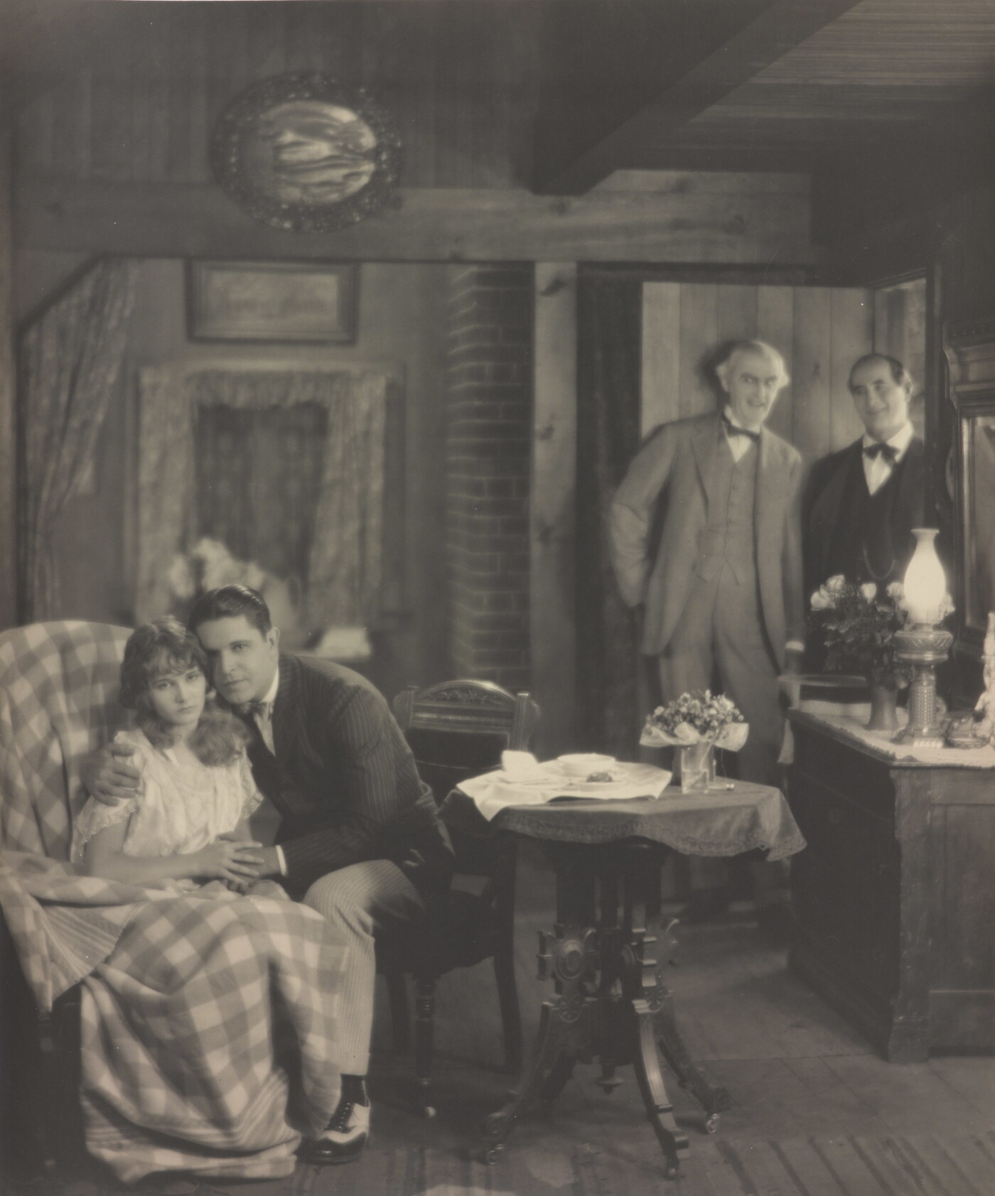 [Two older men watching Lucille Ricksen and young suitor, "Idle Tongues ...