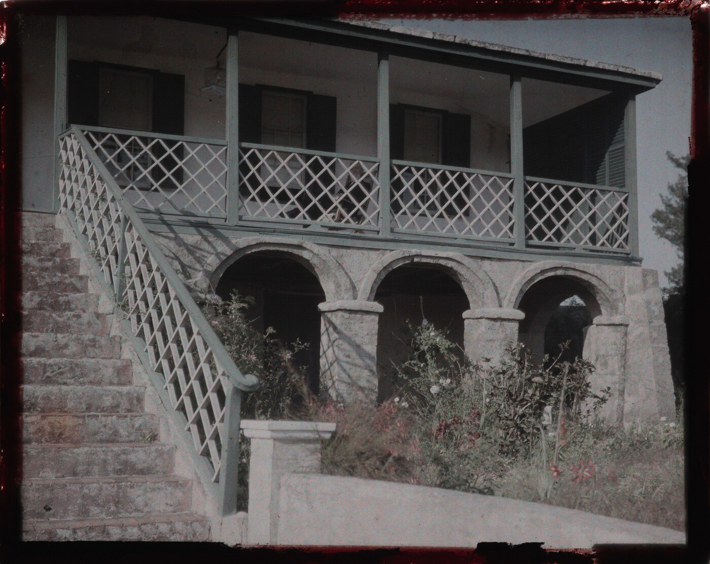 [Bermuda - raised house with arches and lattice work porch railings ...